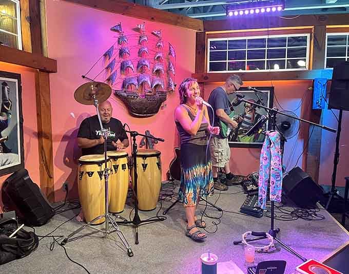 Live music under pink lights and a ship model overhead creates an atmosphere that's part Caribbean, part Wisconsin charm.