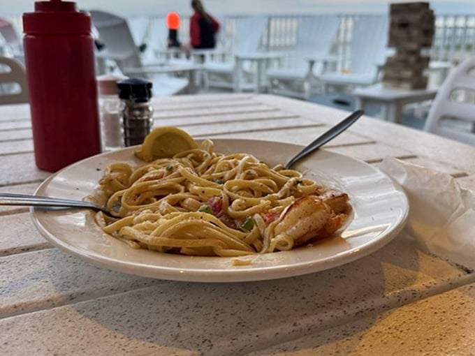 Shrimp pasta that looks this good with the Atlantic as your backdrop? That's what vacation dreams are made of.