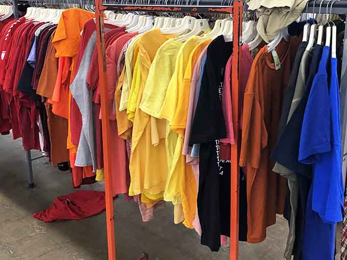 A rainbow of t-shirts organized by color, making it easier to find exactly what you didn't know you needed.