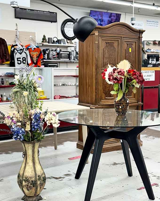 That glass table and those decorative vases are ready to class up someone's living room immediately.