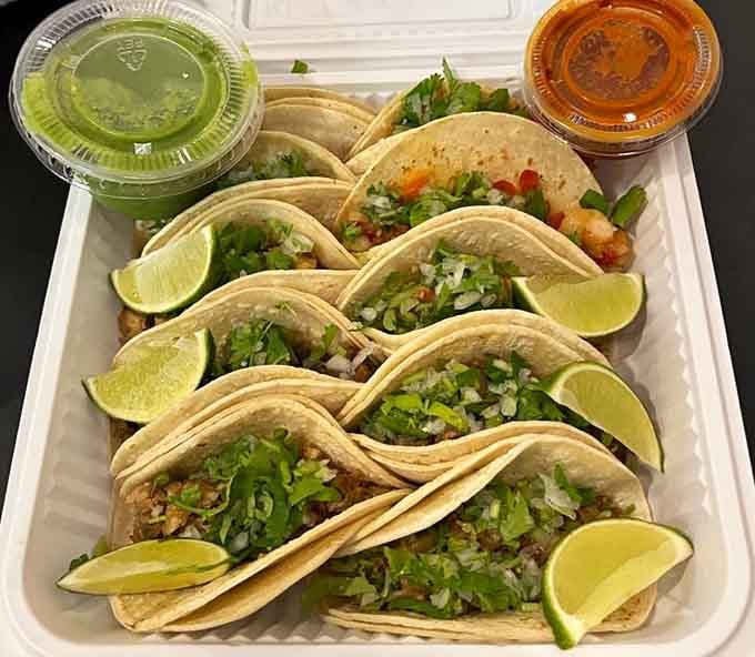 Street-style tacos with fresh lime wedges and two kinds of salsa&mdash;this is how tacos are meant to be.