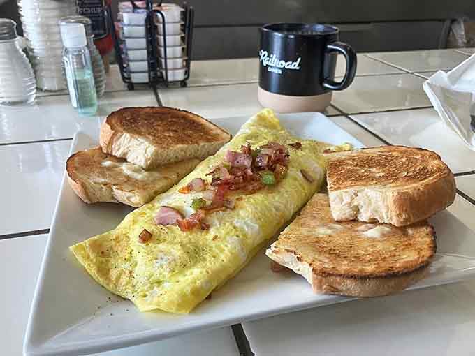 That golden omelet with perfectly toasted bread proves breakfast doesn't have to be complicated to be spectacular.