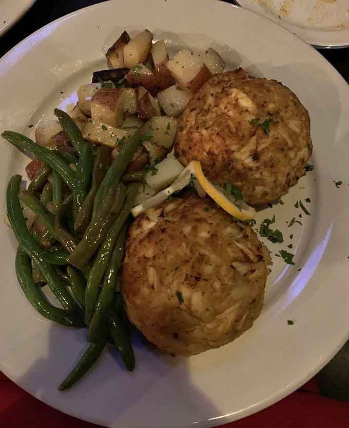 Golden-brown perfection on a plate: crab cakes that would make your grandmother weep with joy.