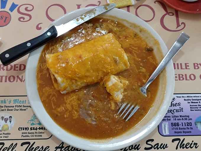 Golden, glistening, and generously portioned, this is what green chile dreams are made of every single night.