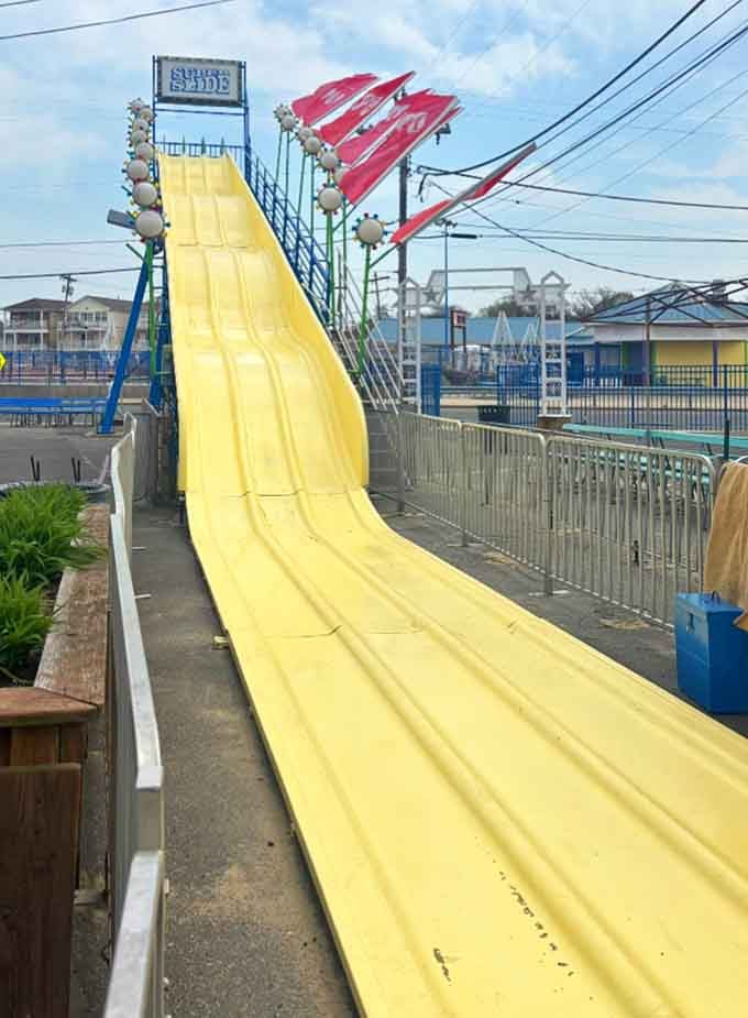 The Super Slide: where rational adults suddenly forget they have mortgages and responsibilities waiting back home.