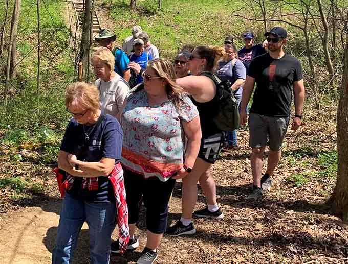 Nothing says "we're having fun" quite like a group hike where everyone's still smiling. Give it another mile.