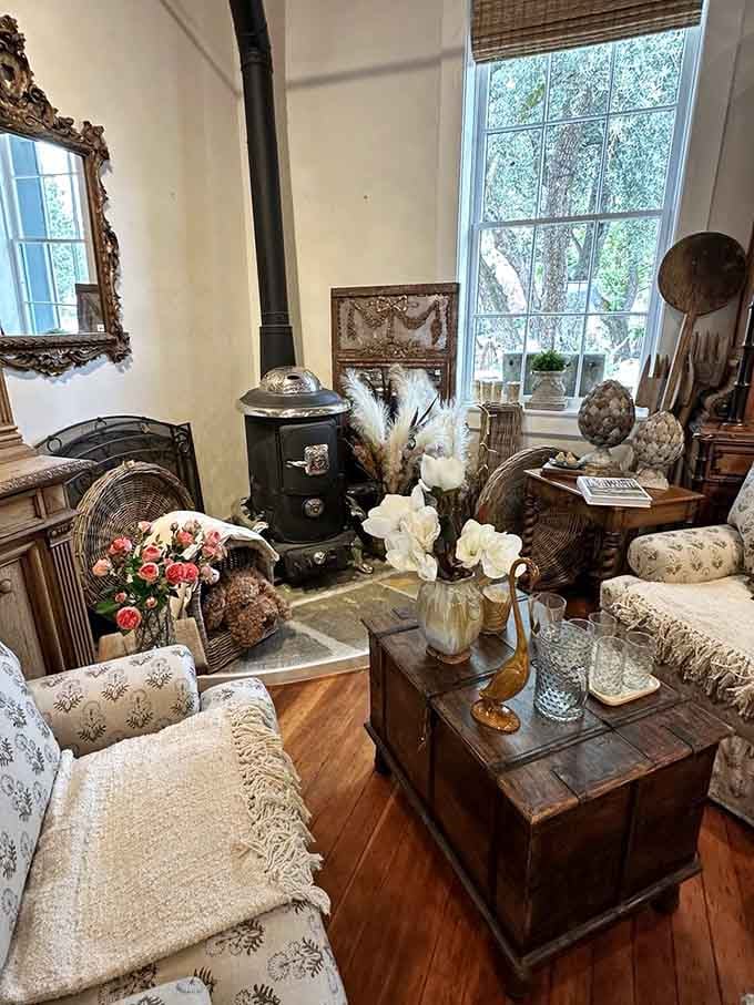 A vintage stove surrounded by carefully curated antiques creates the coziest corner you never knew you needed.