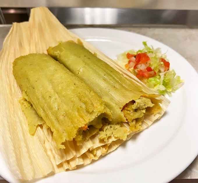 Tamales so tender they practically melt, proving corn husks can hide some of life's greatest pleasures inside them.