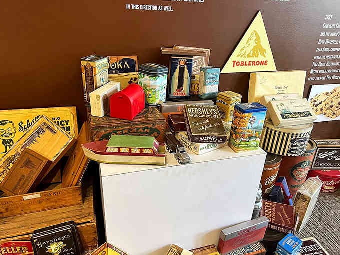 Vintage chocolate tins and packaging tell sweet stories from decades past, like edible time capsules displayed.
