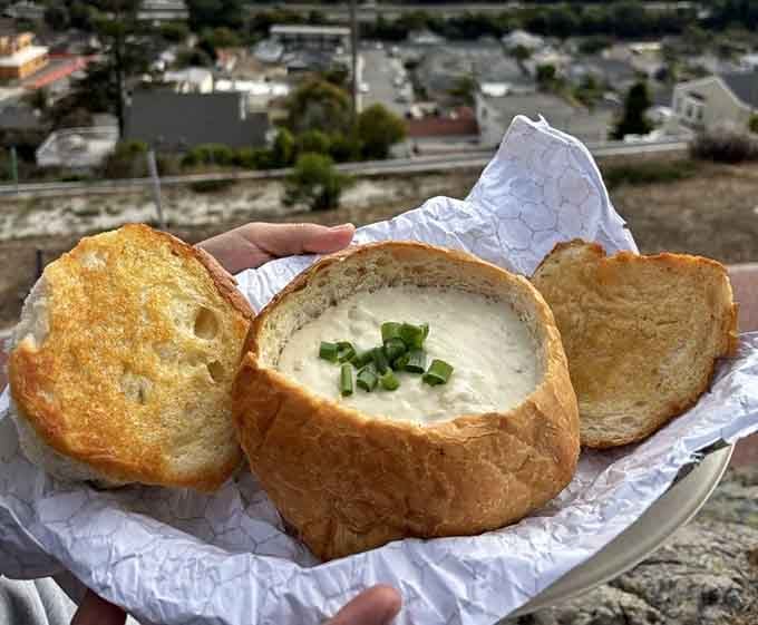 The bread bowl trinity: crusty exterior, pillowy interior, and enough clam chowder to make you believe in miracles.