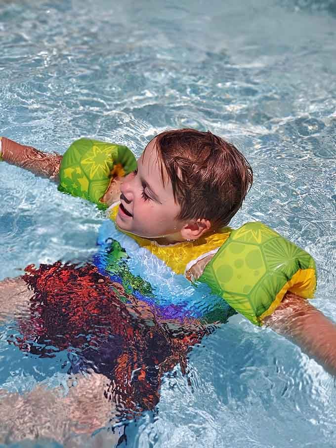 Pure joy captured in chlorinated water, proving happiness doesn't need a complicated recipe to work perfectly.