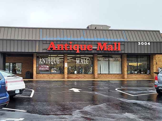 The Antique Mall's red sign beckons treasure hunters like a lighthouse guides ships to shore.