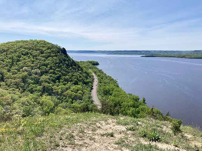 Lake Pepin spreads out below like a giant mirror reflecting every cloud, with bluffs standing guard like nature's sentinels.