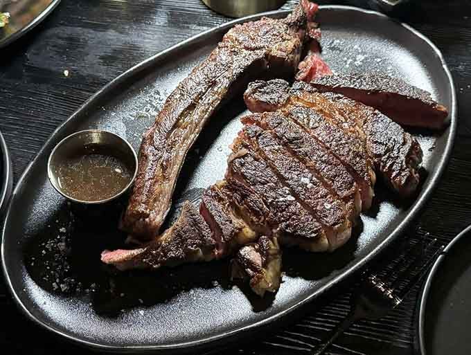 Behold the tomahawk: a steak so magnificent it deserves its own spotlight and possibly a standing ovation.