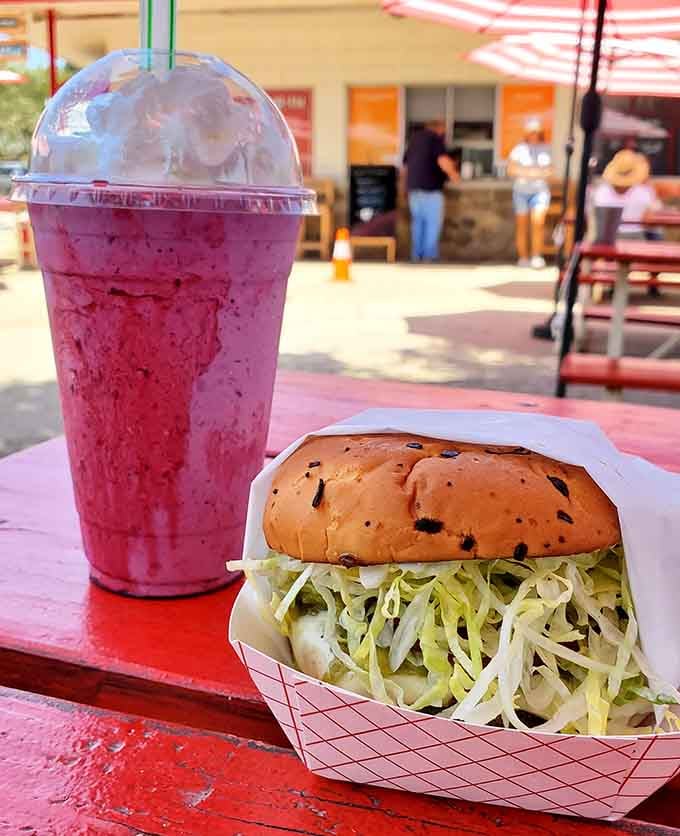 A sesame-studded burger paired with a berry shake: this is what road trip dreams are made of.