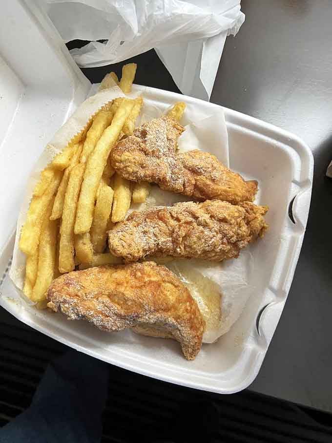 Golden chicken strips that would make Colonel Sanders reconsider his life choices, paired with perfectly crispy fries.