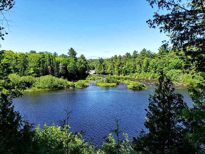 The calm before the storm, where the river takes a breath before its spectacular tumble downstream.