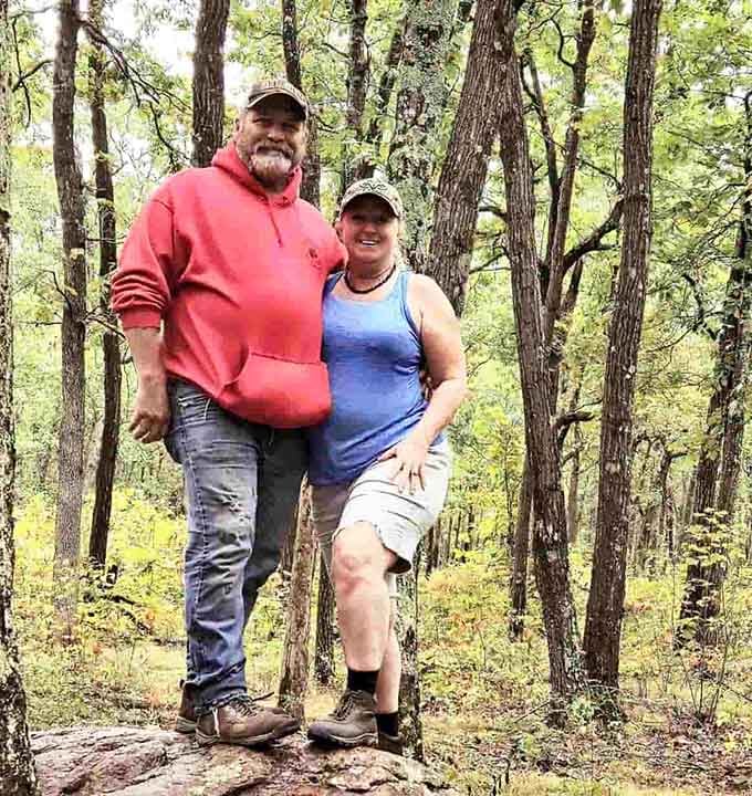 Happy hikers discover that reaching Missouri's highest point creates smiles bigger than the mountain itself.