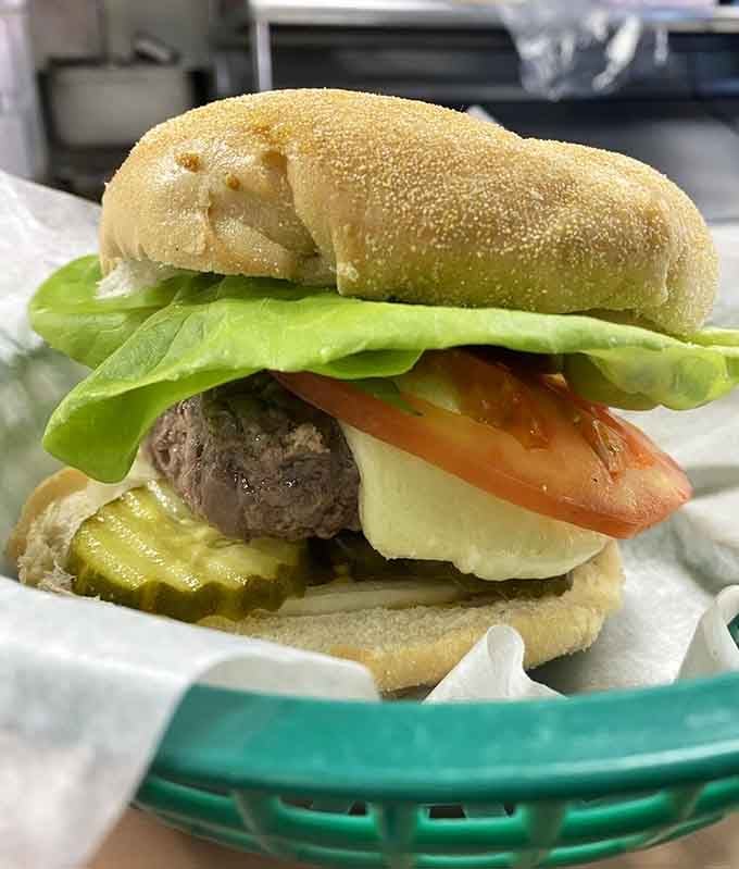 Fresh lettuce, ripe tomato, and crisp pickle nestle against tender steamed beef on a perfectly soft bun that knows its job.