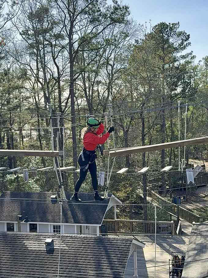 Suspended above rooftops, this adventurer proves that the best views require a little courage and excellent balance.