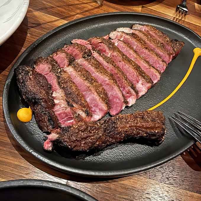Perfectly sliced steak with that gorgeous pink center proves that some things in life are worth the wait and the calories.