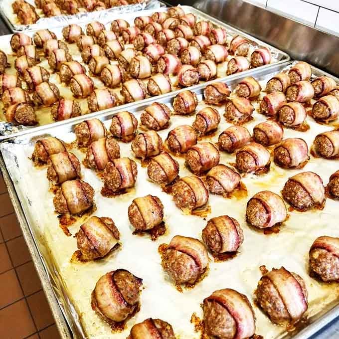 Rows of bacon-wrapped meatballs lined up like edible soldiers ready to march straight into your heart and arteries.