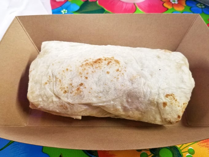 Behold the burrito that requires an engineering degree to eat properly, wrapped tight and ready for your two-handed commitment.