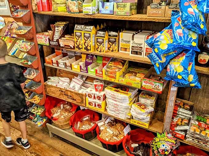 Wooden shelves stacked with vintage candy boxes remind you that some pleasures never go out of style.