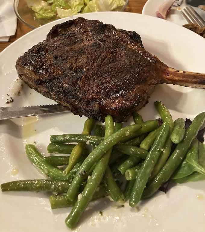 This tomahawk steak looks like something Fred Flintstone would order, except it's actually cooked to perfection.