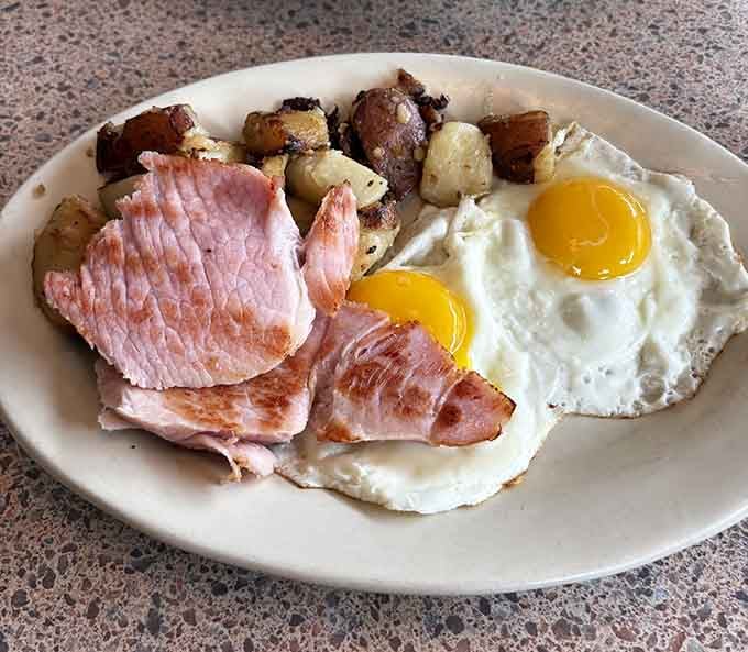 Ham and eggs with golden home fries: proof that simple perfection never goes out of style.