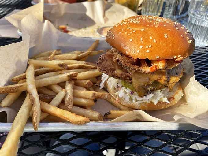 The Triumph burger lives up to its name, stacked high with fried chicken that's golden, crispy, and absolutely glorious.