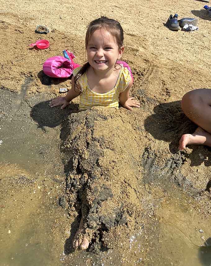 Pure joy captured in one sandy moment, because childhood memories are made at places like this.