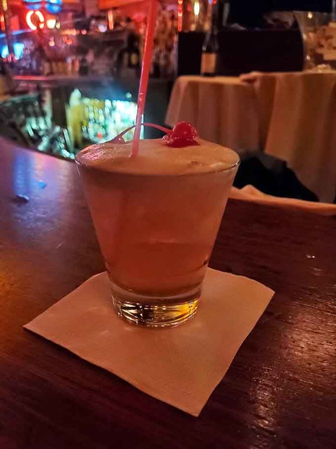A cherry-topped cocktail that looks innocent but probably knows all the Green Mill's best secrets.