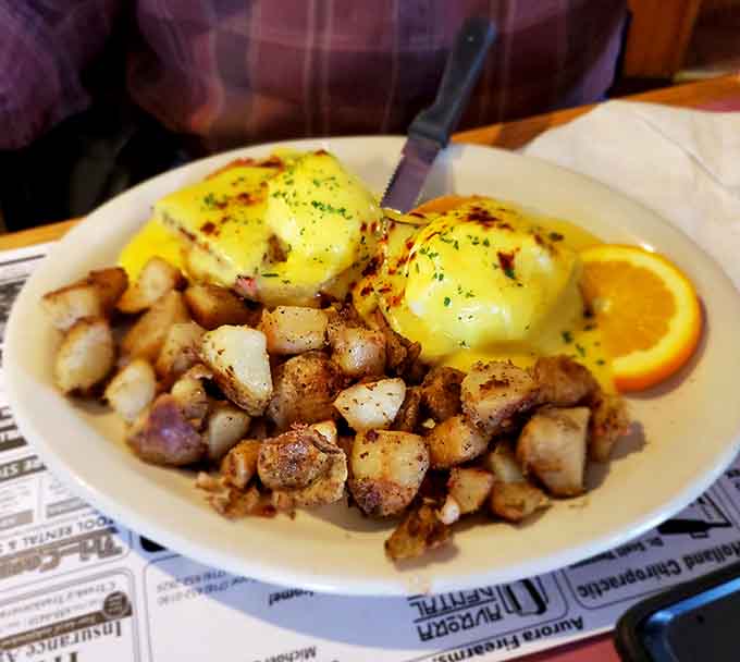 Eggs Benedict with hollandaise this golden deserves its own spotlight, accompanied by perfectly crisped home fries.