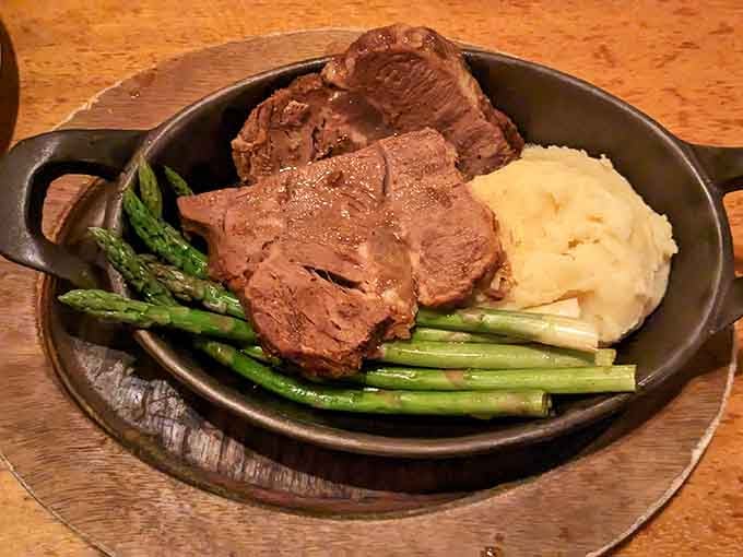 Pot roast so tender it practically melts on your fork, served with asparagus and mashed potatoes that would make your grandmother jealous.