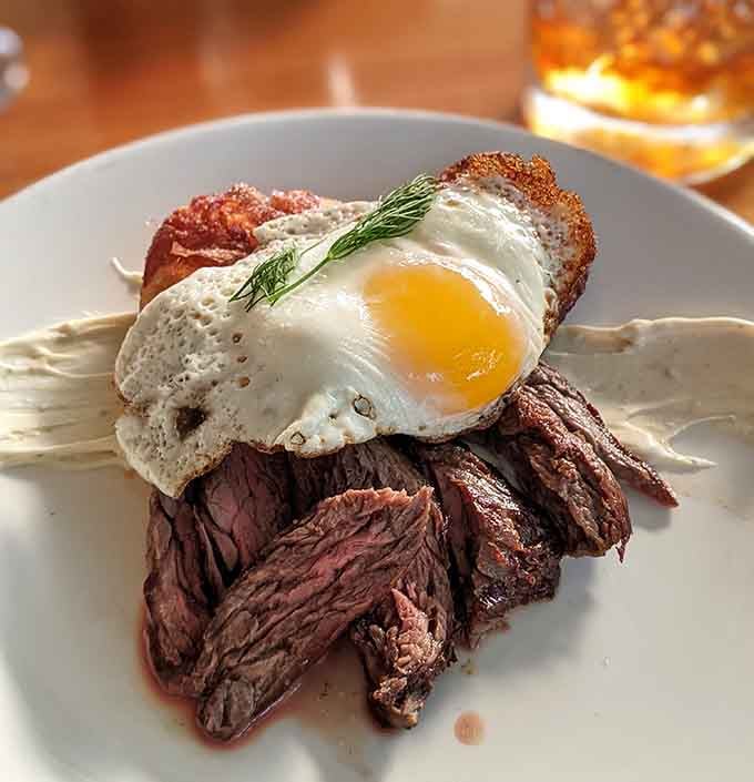 Perfectly cooked steak topped with a sunny egg, because sometimes Norwegian cuisine knows exactly what your American heart needs.