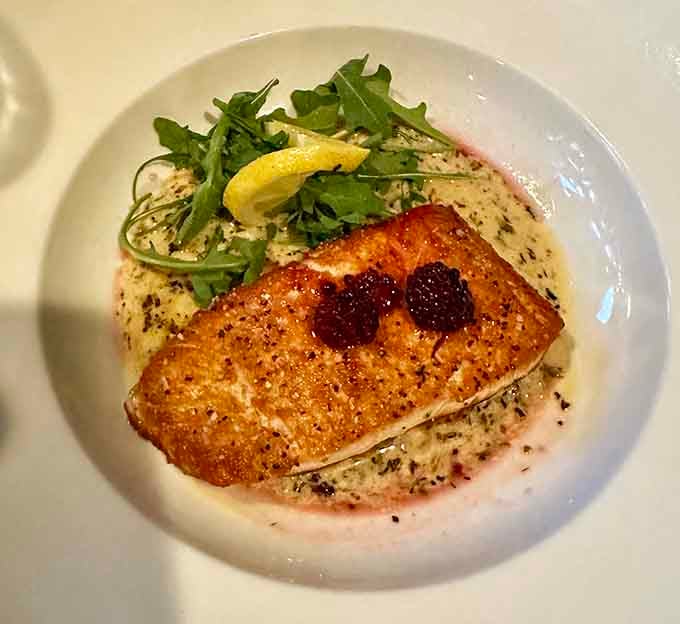 Perfectly seared salmon that looks like it swam straight from the ocean onto your plate this morning.