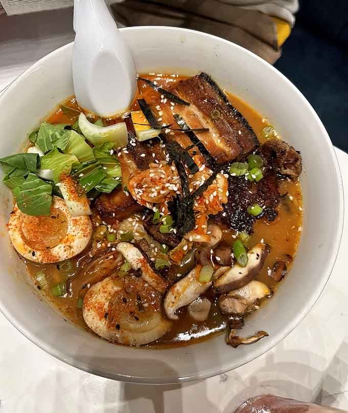 Spicy ramen topped with perfectly cooked pork belly proves The Stockpot takes its global flavors seriously and deliciously.