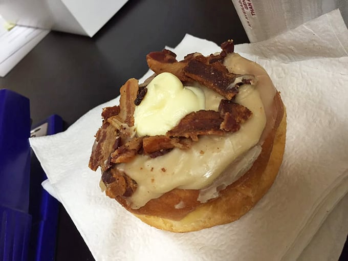 Behold the maple iced cream cheese bacon donut, a creation that laughs in the face of moderation and wins.