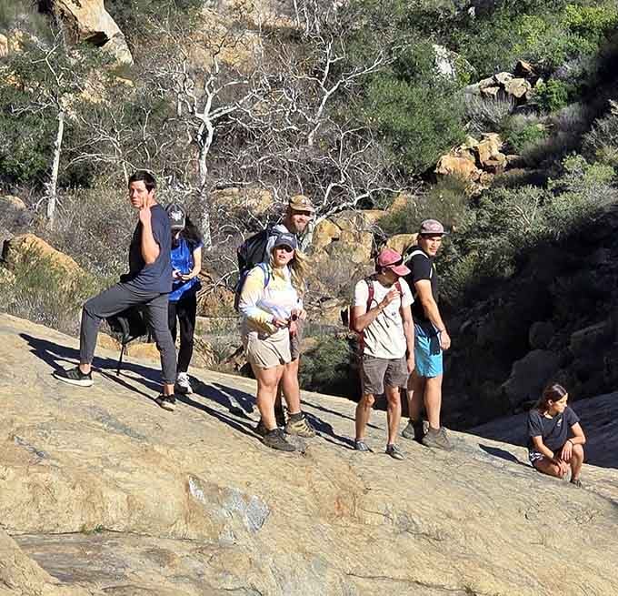 Fellow adventurers pausing mid-descent, probably realizing that what goes down must eventually climb back up with complaining legs.