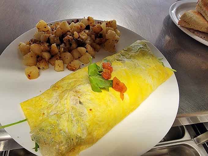 That omelet isn't messing around, folks; it's stuffed, golden, and ready to fuel your entire day with deliciousness.