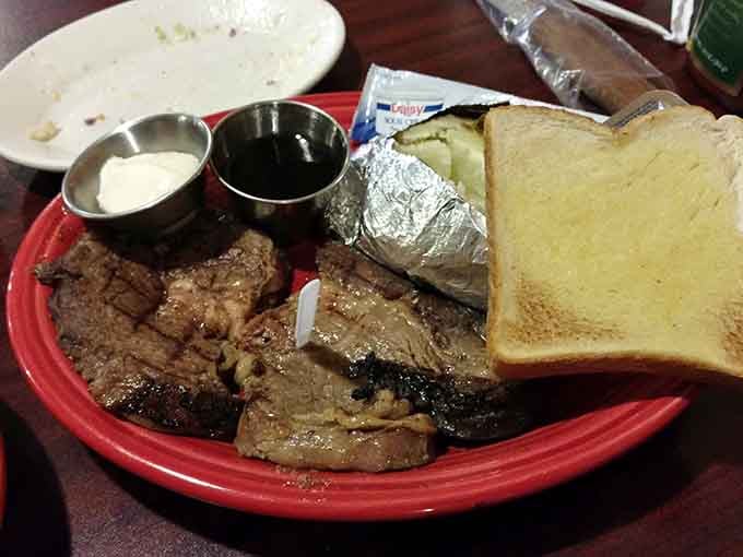Juicy prime rib at Tony&rsquo;s Steak Barn comes with toast, potato, and sides, making a hearty, satisfying meal for any appetite.