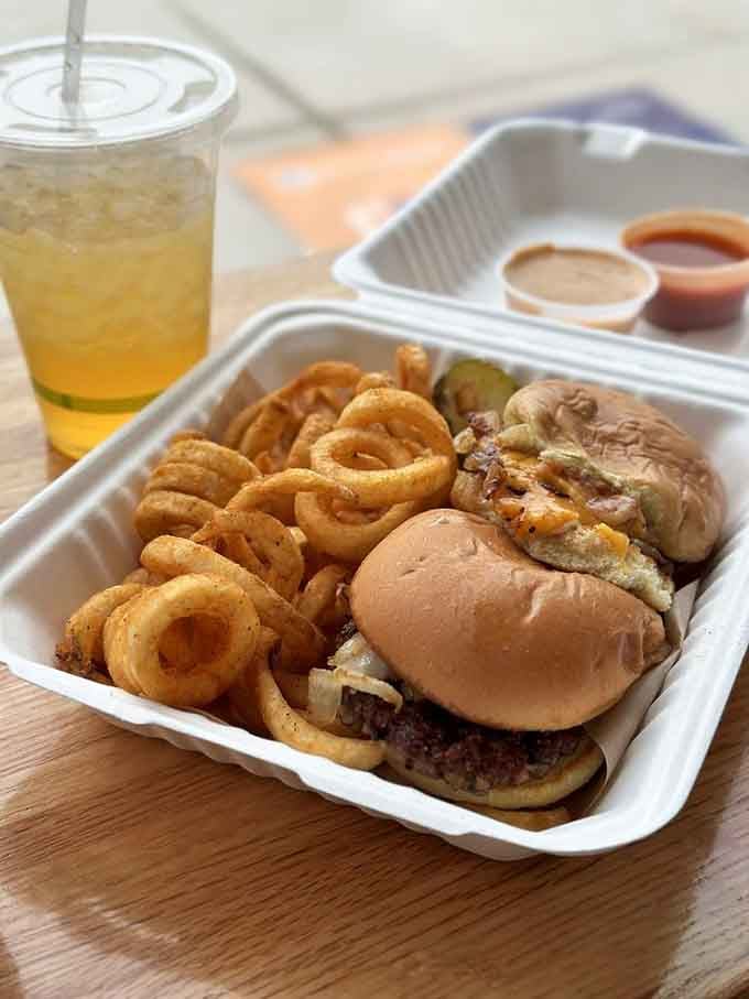 The Slider with curly fries proves vegan food can absolutely deliver on the indulgence you're craving today.