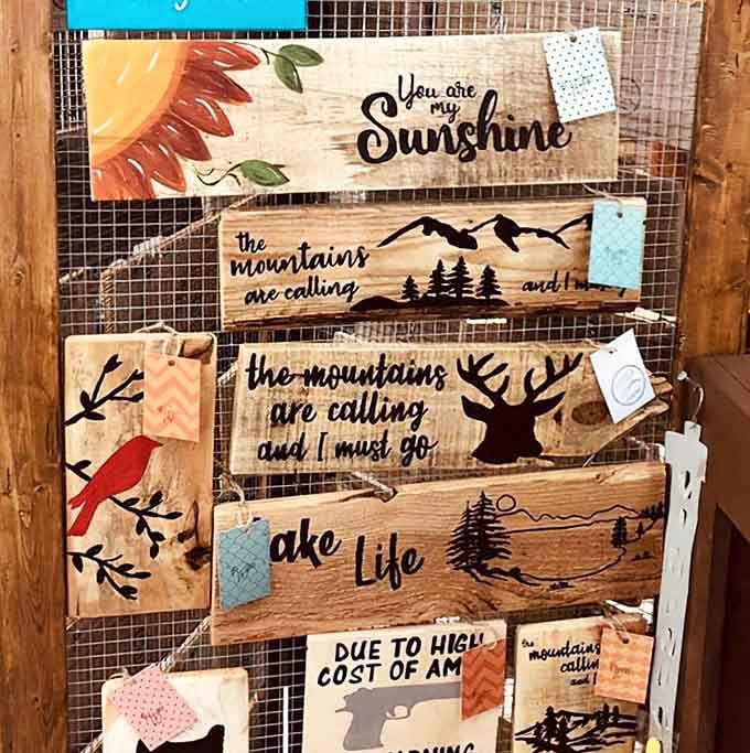 Handcrafted wooden signs remind you that "the mountains are calling" and your wallet is apparently answering with enthusiasm.