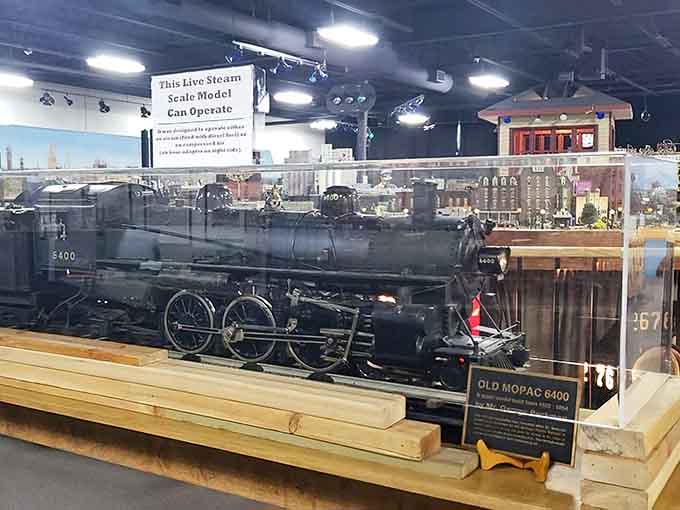 The Old Mopac 6400 steam engine sits majestically behind glass, a testament to the golden age of railroading.