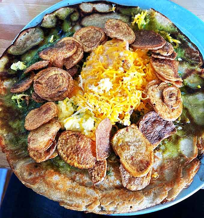 That golden pancake loaded with vegetables proves the Dutch know their way around comfort food brilliance.