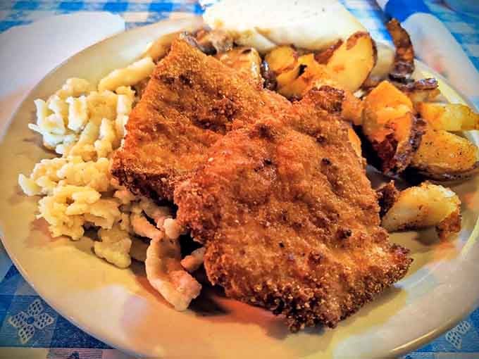 Golden, crispy schnitzel with sp&auml;tzle and roasted potatoes &ndash; this is the kind of plate that makes diets take a vacation.