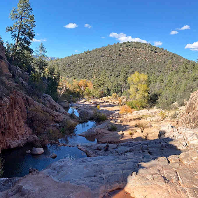 Crystal pools reflect the sky between canyon walls, offering nature's own infinity pool without the resort fees.