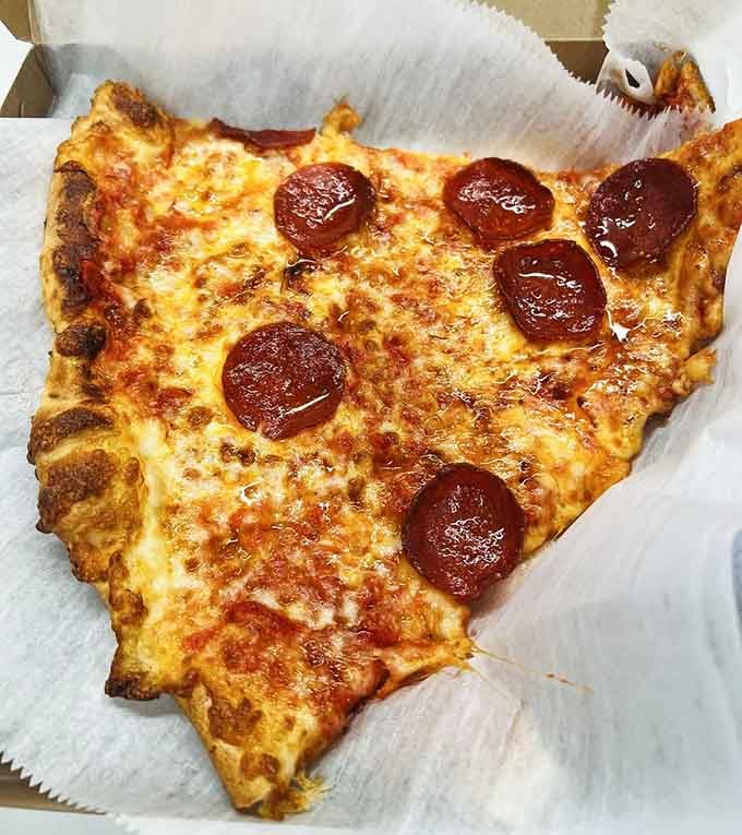 Golden cheese bubbling over perfectly placed pepperoni, this slice proves gas stations can deliver gourmet-level satisfaction every time.