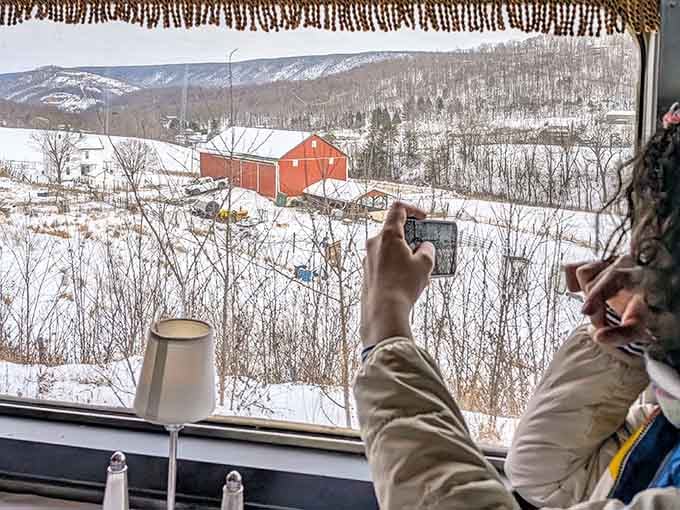 Snapping photos of snow-covered barns from your window because some views demand to be captured and shared immediately.